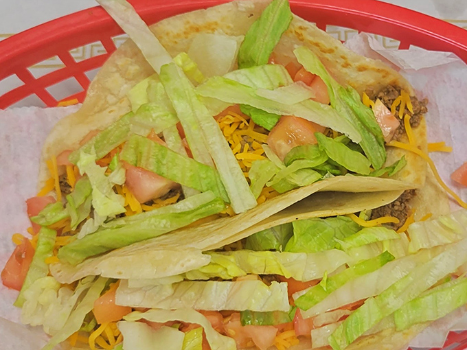 Breakfast tacos that would make a Texan nod in approval. Fresh lettuce, cheese, and seasoned meat create a morning fiesta worth waking up for. 