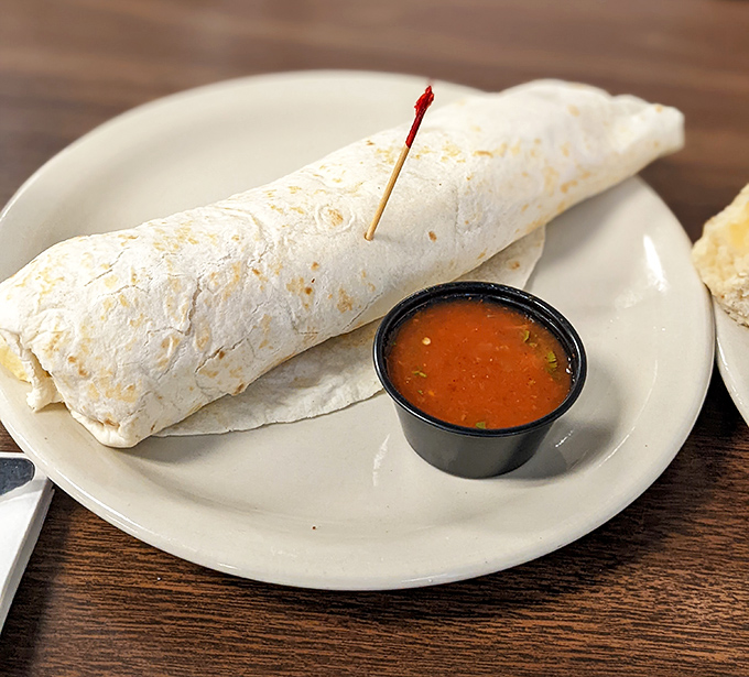 This breakfast burrito isn't messing around&mdash;stuffed with savory fillings and served with a side of salsa that'll wake you up faster than your morning coffee.