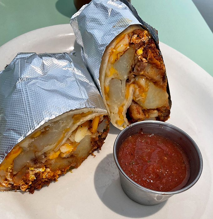 Breakfast burritos that require two hands and zero shame—packed with potatoes, eggs, and chorizo, they're architectural marvels wrapped in foil.