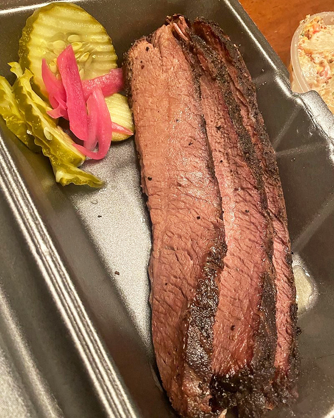 Brisket so tender it practically surrenders to your fork. That smoke ring is the barbecue equivalent of a Michelin star.