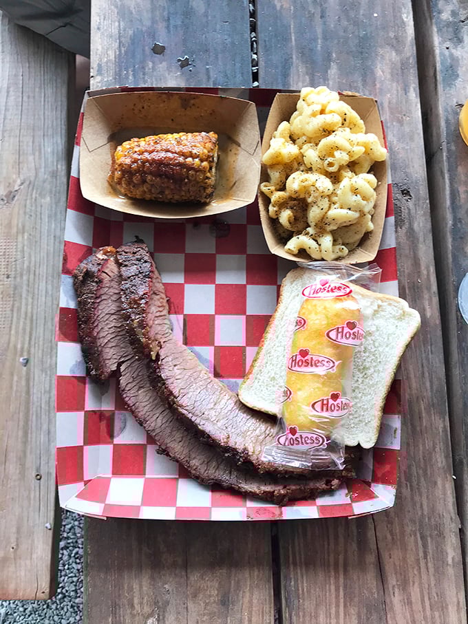 Brisket sliced against the grain reveals that perfect pink smoke ring&mdash;visual evidence of the low-and-slow religion practiced by Oklahoma's barbecue faithful.