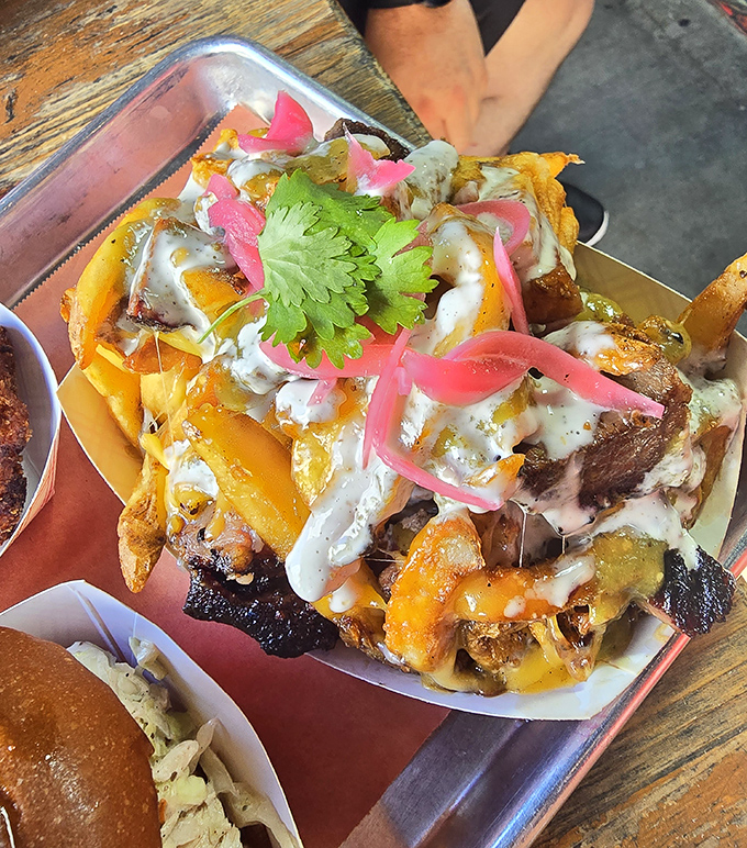 Loaded fries that blur the line between side dish and main event. When brisket decides to crowd-surf on French fries, you don't ask questions—you grab a fork.