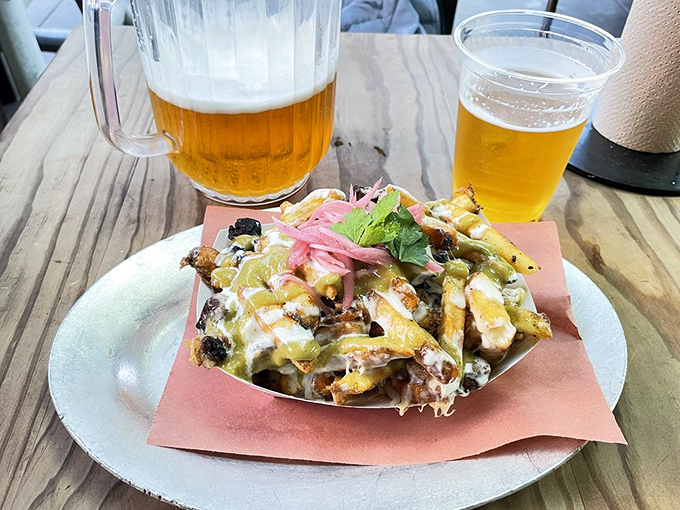 These loaded fries aren't just a side &ndash; they're a main event dressed in cheese, topped with pickled onions, and ready for their close-up.