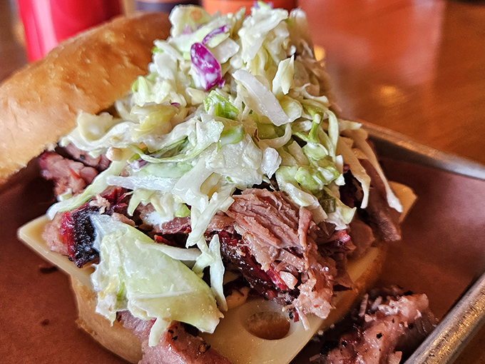 The brisket Reuben reimagined: where smoky beef meets crisp slaw in a relationship that makes traditional Reubens jealous.