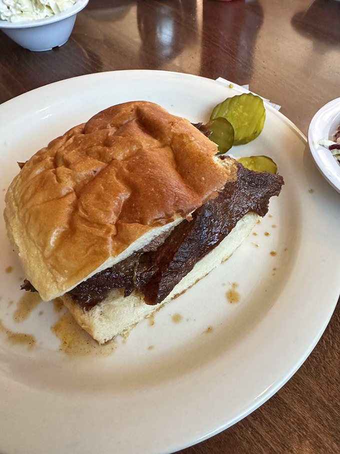 Sandwich architecture at its finest! This brisket creation proves that sometimes the best things in life come between two pieces of bread.