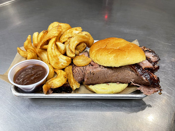 A brisket sandwich that demands respect. That smoke ring isn't just for show&mdash;it's a flavor halo earned through hours of patient smoking.