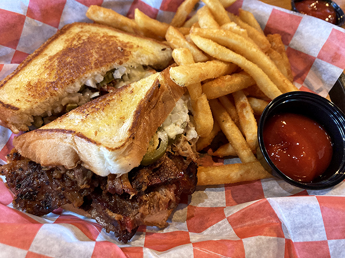 This brisket sandwich doesn't just feed hunger; it creates the kind of messy, glorious experience that defines great barbecue.