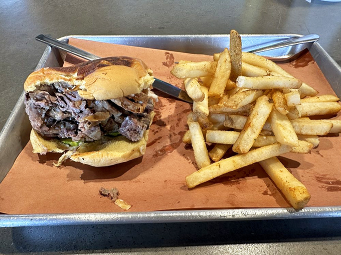 Behold the brisket sandwich&mdash;where smoke-kissed beef finds its soulmate in a pillowy bun, while fries stand by as loyal companions. 