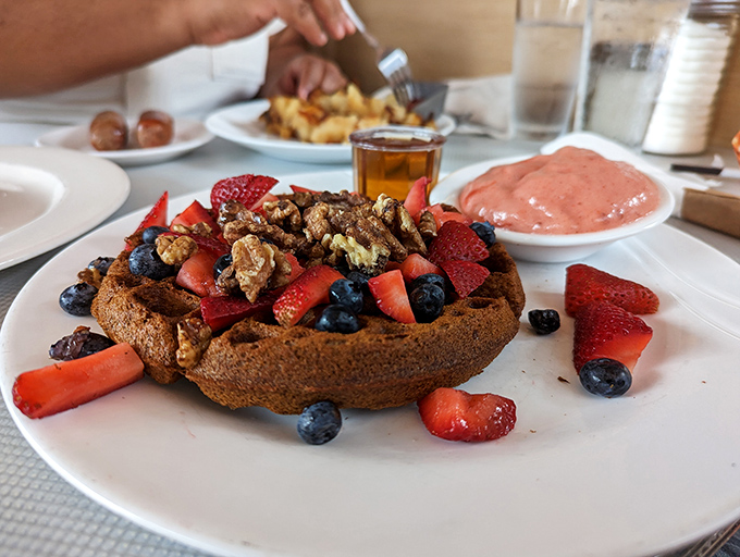 A buckwheat waffle that's throwing a berry party and everyone's invited &ndash; especially that strawberry red carpet and blueberry VIP section.