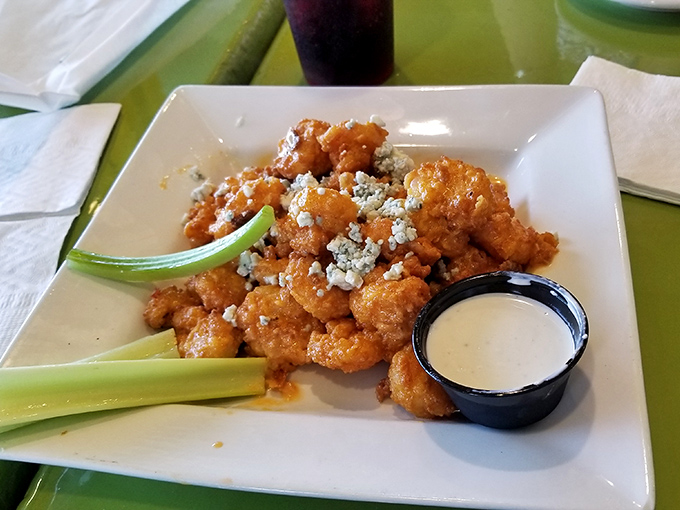 Buffalo shrimp: where coastal cuisine meets sports bar favorite. Those celery sticks aren't just garnish&mdash;they're the life rafts your taste buds might need.