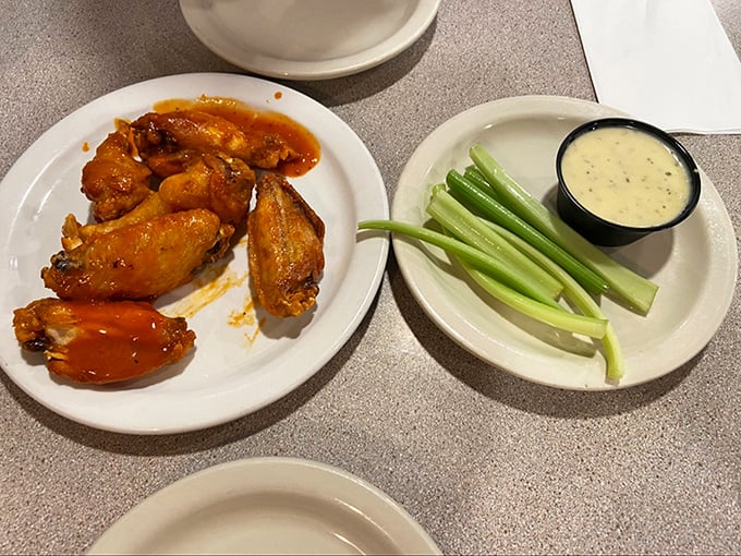 Buffalo wings that don't need a sporting event as an excuse. That vibrant orange sauce isn't just a color&mdash;it's a commitment to flavor that demands respect.