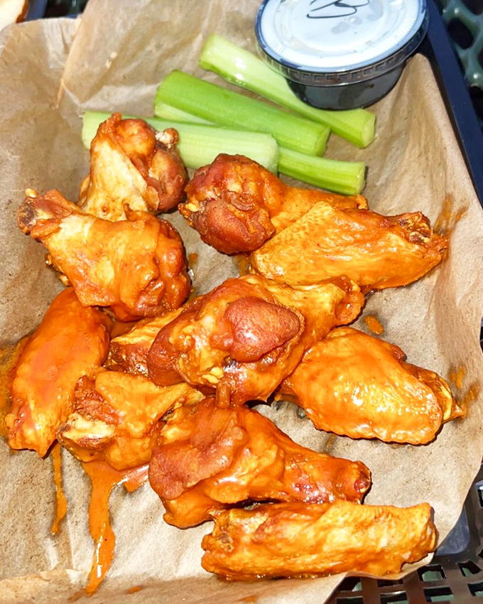 These buffalo wings aren't messing around. Crispy, saucy perfection that demands both napkins and your full attention.