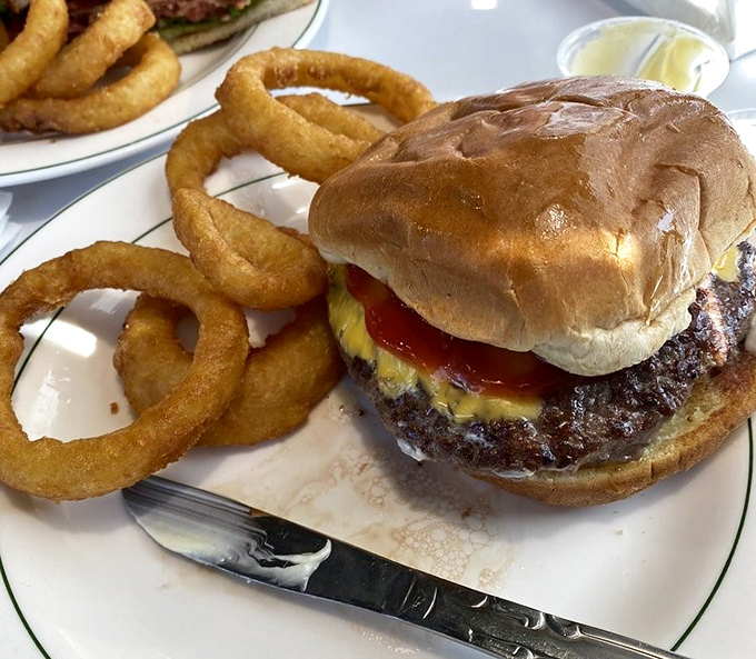 This isn't one of those trendy burgers that needs a Instagram filter. It's the real deal &ndash; hand-formed, juicy, and served with onion rings that could double as golden halos.