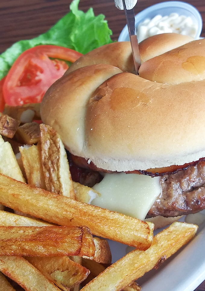 A burger that doesn't need fancy toppings to impress, just honest beef, melty cheese, and fries that could start their own fan club.