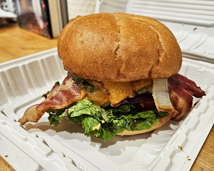 This isn't just a burger&mdash;it's architecture. The perfect stack of bacon, lettuce, and beef on a golden throne of a bun.