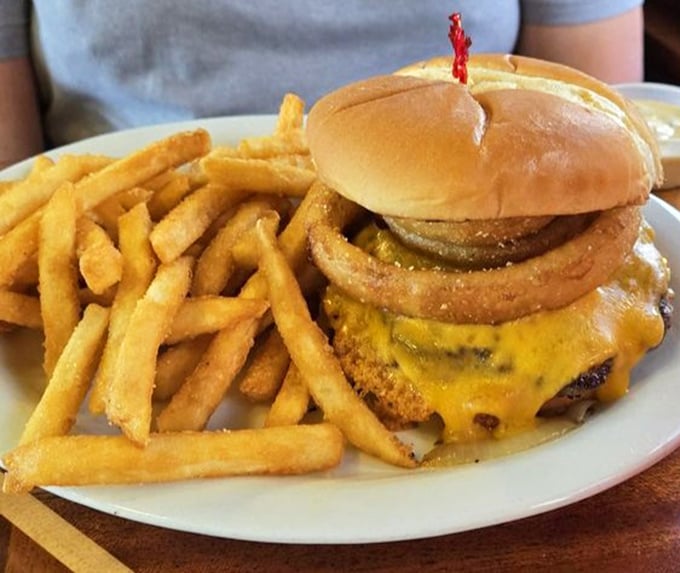 The classic cheeseburger and fries&mdash;proof that simple pleasures done right never go out of style. That melty cheese cascade is what food dreams are made of.