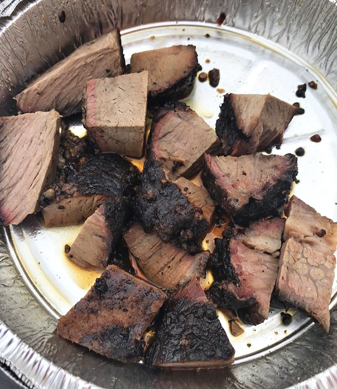 Burnt ends looking like edible gemstones, each piece a smoky treasure worth its weight in napkins.