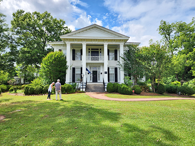 The Burt-Stark Mansion stands like Southern royalty, complete with columns that could tell stories for days.