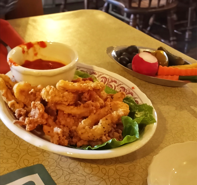 Crispy calamari: the perfect opening act before the beef headliner. Those golden rings are practically begging for a dip in that sauce.
