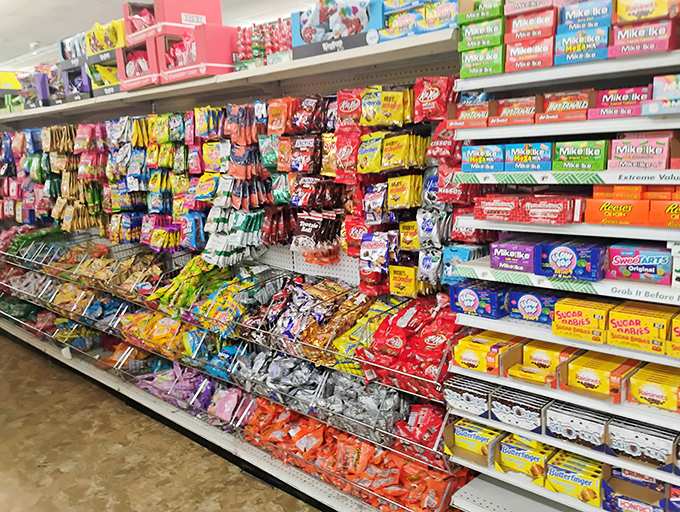 A candy aisle that would make Willy Wonka jealous. The rainbow of sweet treats represents every possible sugar craving a human could experience.