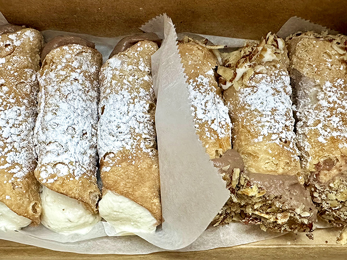 Cannoli so authentic they should come with their own passport. Crisp shells, creamy filling, and a dusting of powdered sugar.
