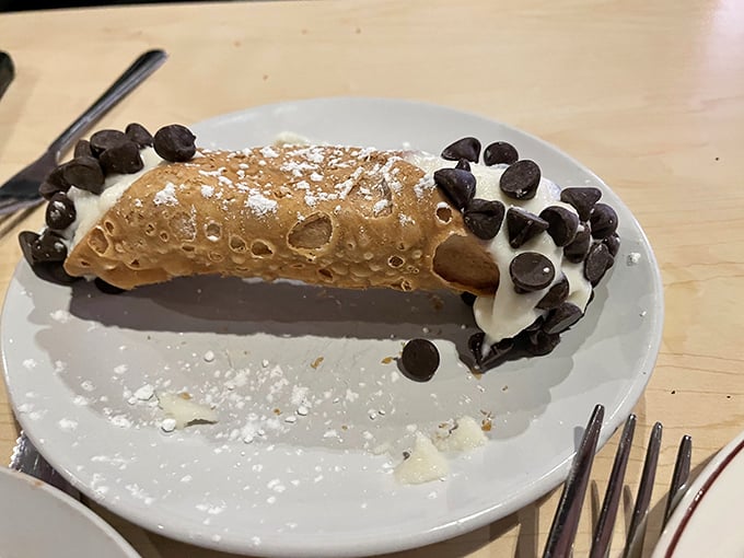 That crispy shell filled with sweet ricotta and studded with chocolate chips is pure Italian-American bliss.