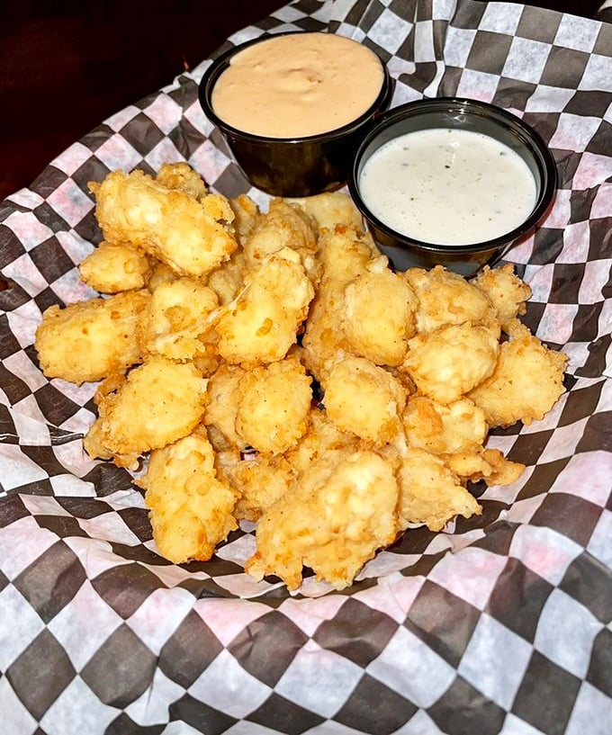 Wisconsin cheese curds: where "squeaky" meets "crispy" in a dance of dairy perfection. These golden nuggets are what French fries dream of becoming.