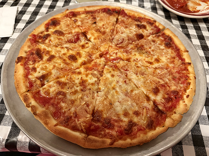 The cheese pizza that launched a thousand cravings. Thin enough to fold, substantial enough to satisfy, and cheesy enough to make Wisconsin jealous.