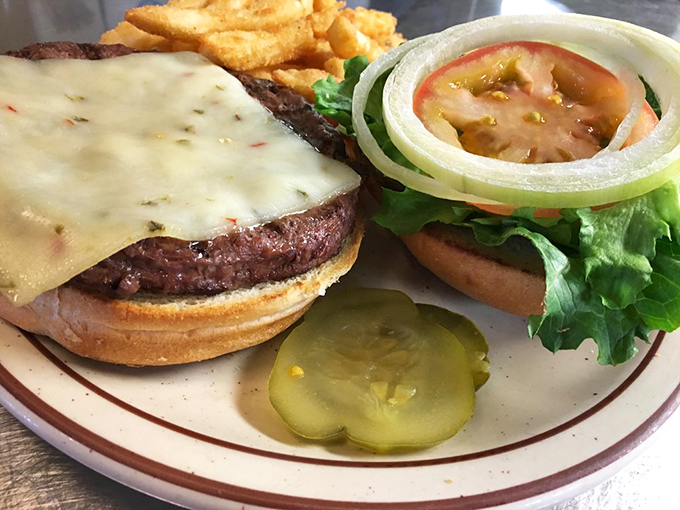 A cheeseburger that doesn't need fancy toppings to impress &ndash; just honest beef, melty cheese, and a pickle that knows its supporting role.