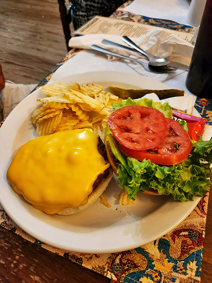 This isn't just a cheeseburger; it's a golden-crowned masterpiece with the perfect ratio of melty cheese to fresh toppings. Diet plans beware.