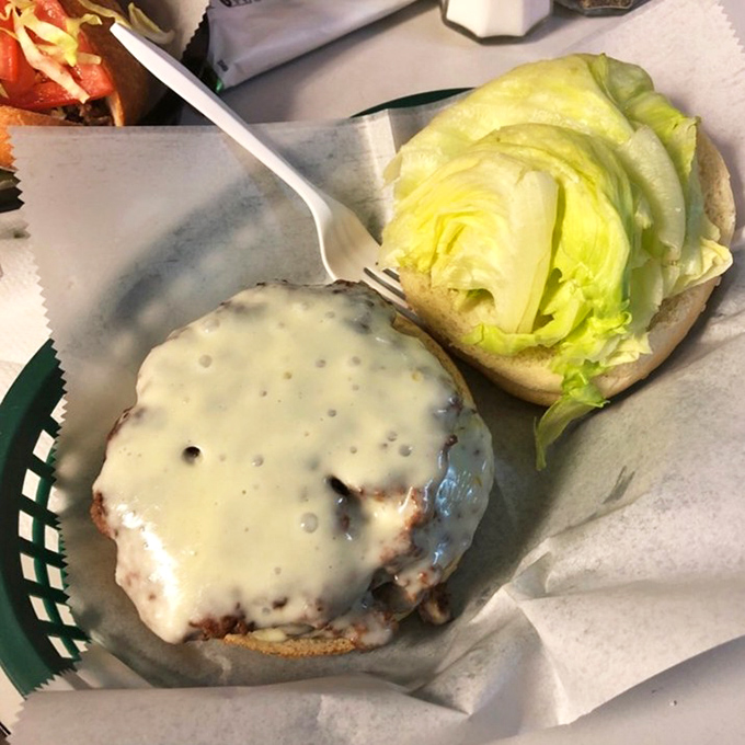 Melted cheese cascades over perfectly grilled beef like a dairy waterfall. This burger doesn't need fancy toppings to make its statement.