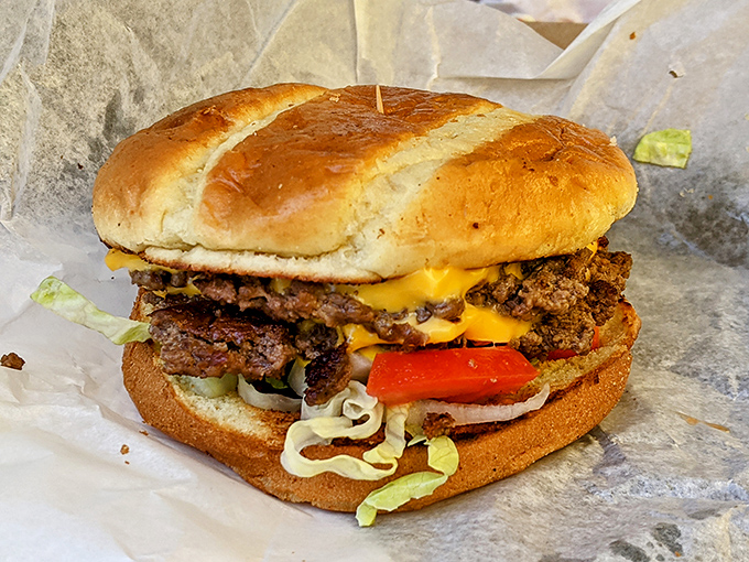 Not just any cheeseburger, but a proper Midwestern masterpiece with all the fixings. The melted cheese cascades like a yellow waterfall of joy. 