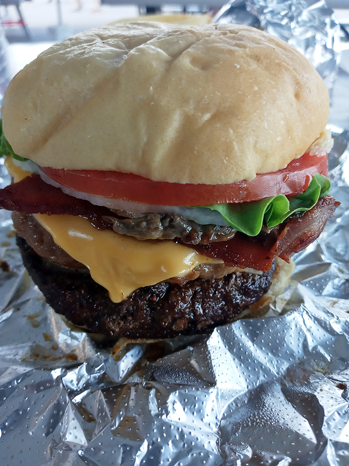 Not all heroes wear capes—some come on a soft bun with melted cheese and bacon. This burger doesn't need Instagram filters; it's already perfect.