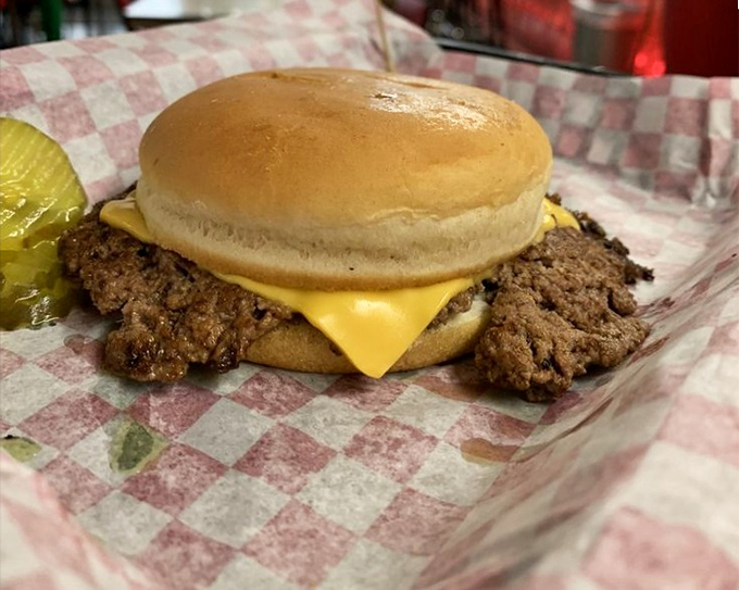Behold the cheeseburger in its natural habitat&mdash;crispy-edged patty with melted American cheese on a simple bun. No pretension, just perfection.
