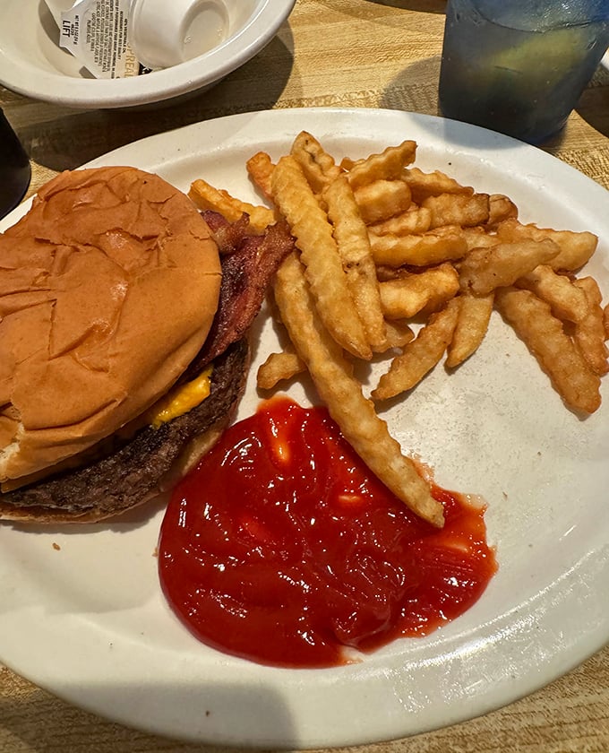 Even diners need to diversify! This classic cheeseburger with golden fries proves Omelet Shoppe isn't just a one-trick breakfast pony.