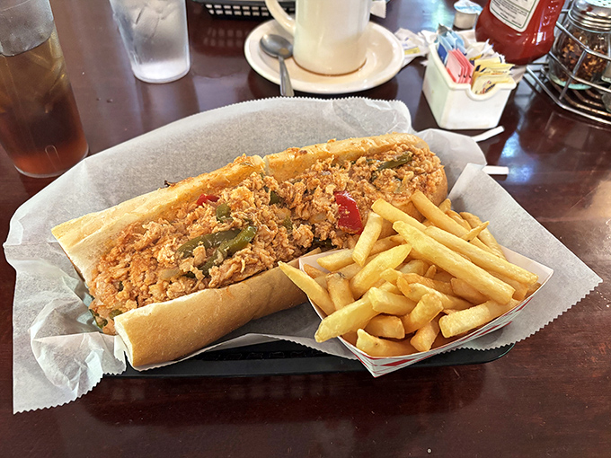 The cheesesteak arrives like a Pennsylvania celebrity&mdash;golden fries standing by as loyal sidekicks to this hearty sandwich that demands both hands and your full attention.