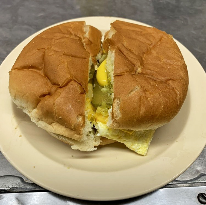 The Cheesy Western, with its perfectly fried egg peeking out, is the breakfast-meets-burger masterpiece you never knew you needed in your life.