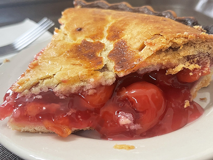 This cherry pie isn't just dessert; it's a ruby-red reminder that some pleasures in life are worth every single calorie.