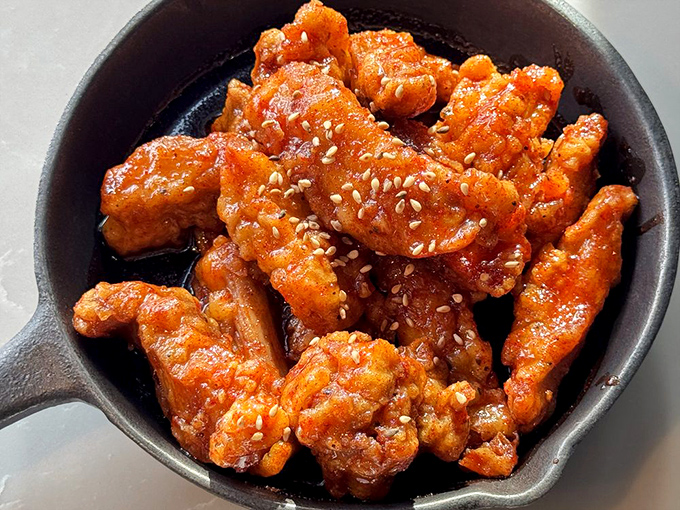 Korean fried chicken that makes the Colonel jealous &ndash; crispy, glazed, and absolutely impossible to share.