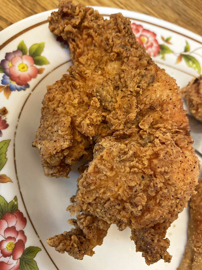 Fried chicken with a crust so perfectly seasoned and crispy, it makes you wonder if Colonel Sanders has been taking notes.