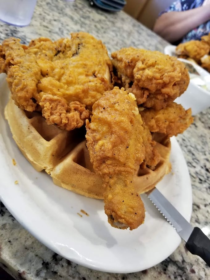 Chicken and waffles: where breakfast and dinner collide in a magnificent display of crispy, fluffy, sweet, and savory harmony.