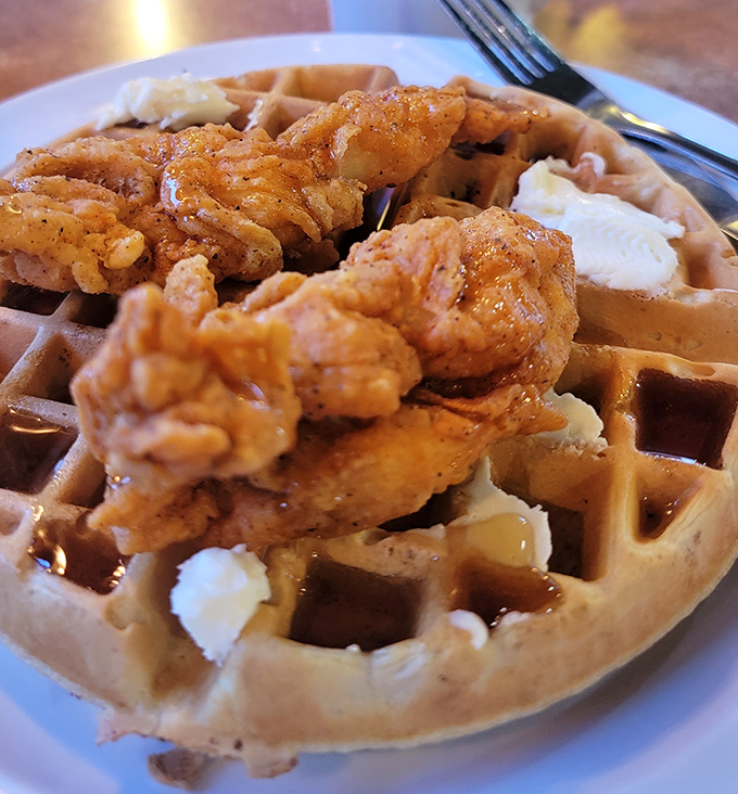 Chicken and waffles: the breakfast-lunch hybrid that proves some of the best relationships are unexpected ones. That golden chicken practically glows with crispy perfection.