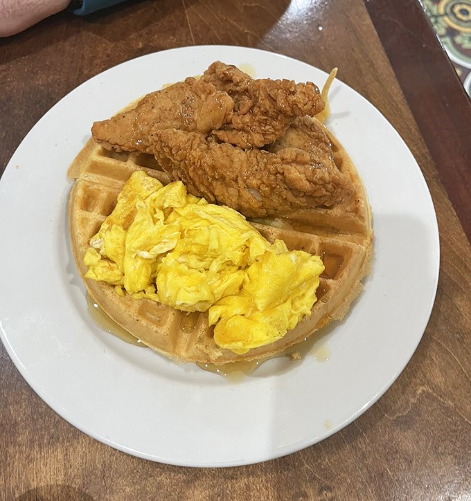 Chicken and waffles: where breakfast and lunch stopped fighting and fell in love. This golden-brown romance might be worth crossing state lines for.