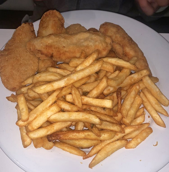 Crispy on the outside, tender within&mdash;the universal language of comfort. These golden chicken tenders and perfectly cooked fries speak directly to your inner child.