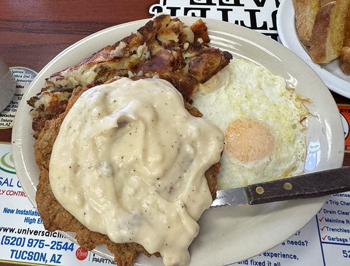Chicken fried heaven smothered in gravy's warm embrace. When your breakfast needs to double as lunch and possibly dinner too.