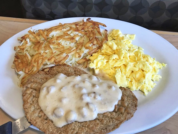 Country-fried steak smothered in gravy alongside golden hash browns and fluffy eggs&mdash;the breakfast equivalent of winning the comfort food lottery.