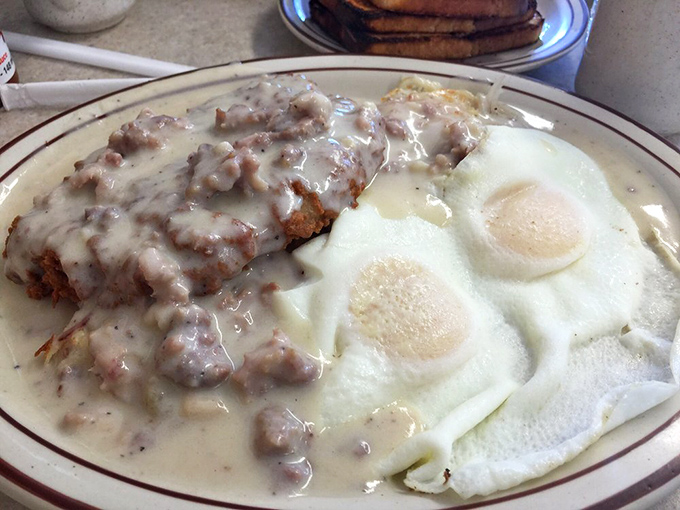 This chicken fried steak swimming in creamy gravy with sunny-side-up eggs might be the most compelling reason to get out of bed on a foggy Oregon morning.