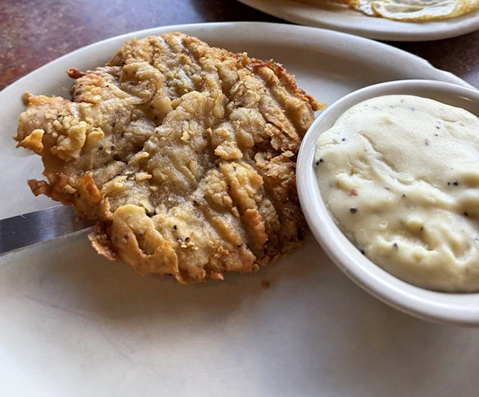 Chicken fried steak that doesn't just break the diet—it shatters it with such delicious abandon you'll be planning your next visit before the last bite.