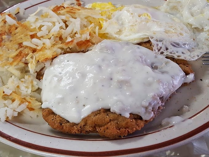 Country fried steak smothered in gravy with a side of hash browns. Heart doctors hate this meal, but your soul will thank you for every decadent bite.