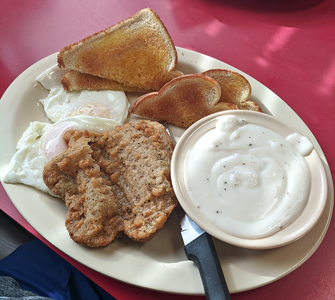 Country-fried steak with gravy and eggs&mdash;the breakfast that answers the question, "Why do people love diners so much?"